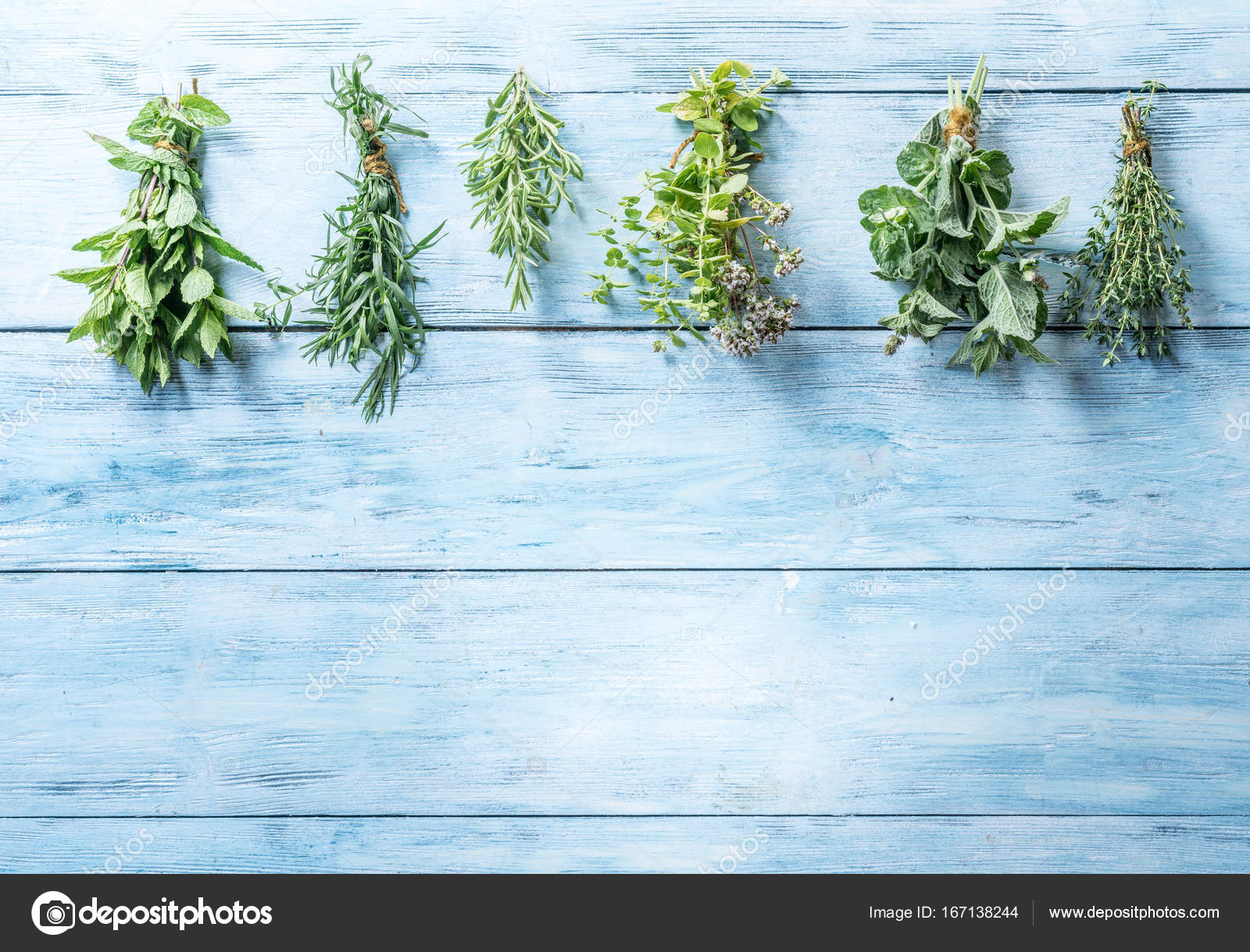 Fresh herbs on the blue wooden background. ⬇ Stock Photo, Image by ...