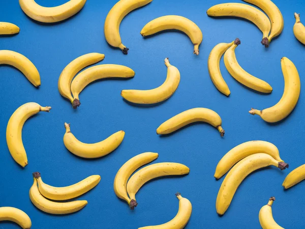 Bananas on the blue background. Stock Photo by ©Valentyn_Volkov 184848616