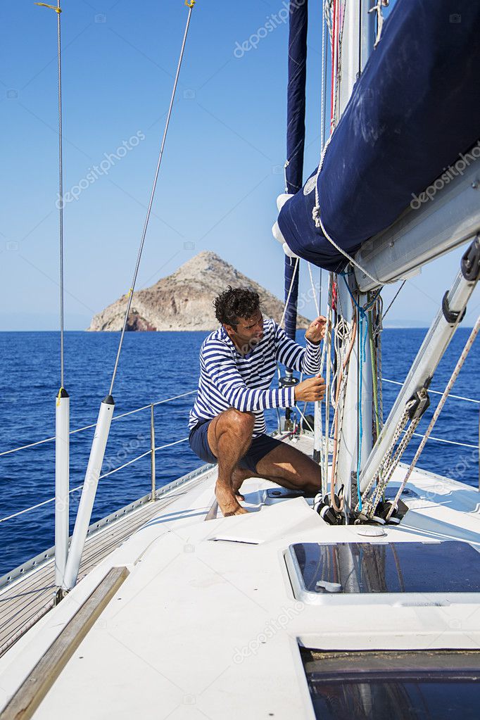 Man on sailboat in sea Stock Photo by ©boggy22 125416792