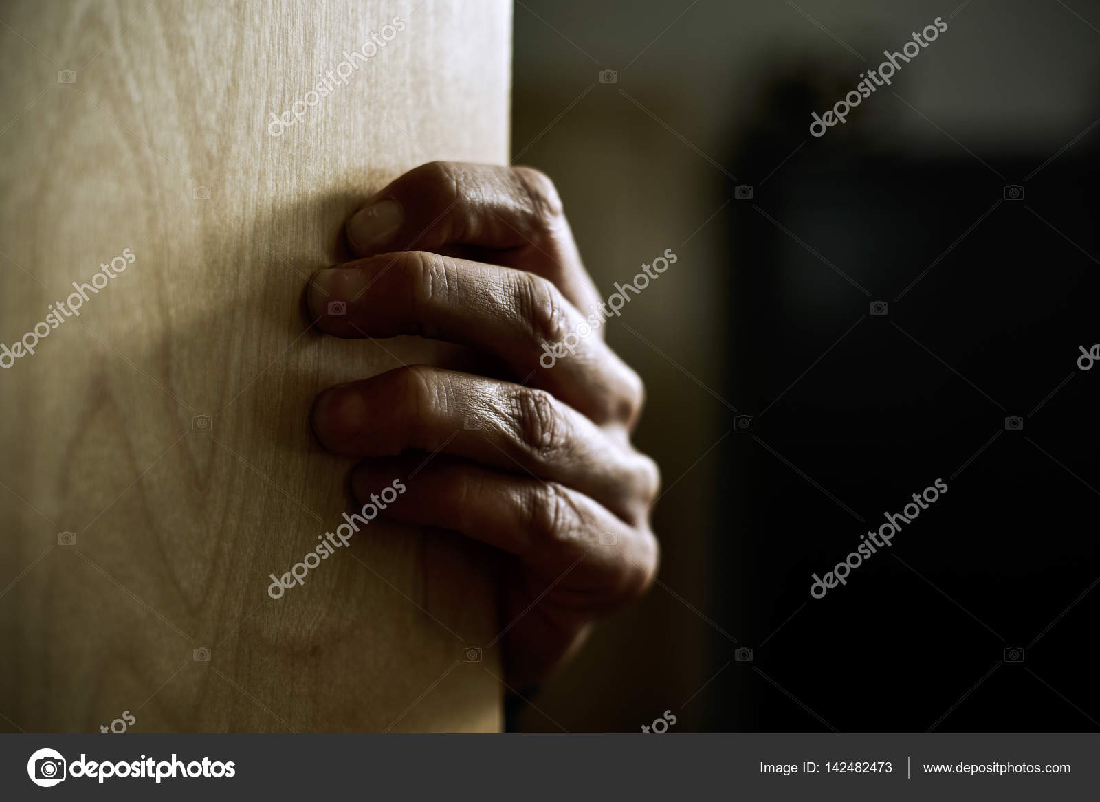 Man hand popping out from behind a door — Stock Photo © nito103 #142482473