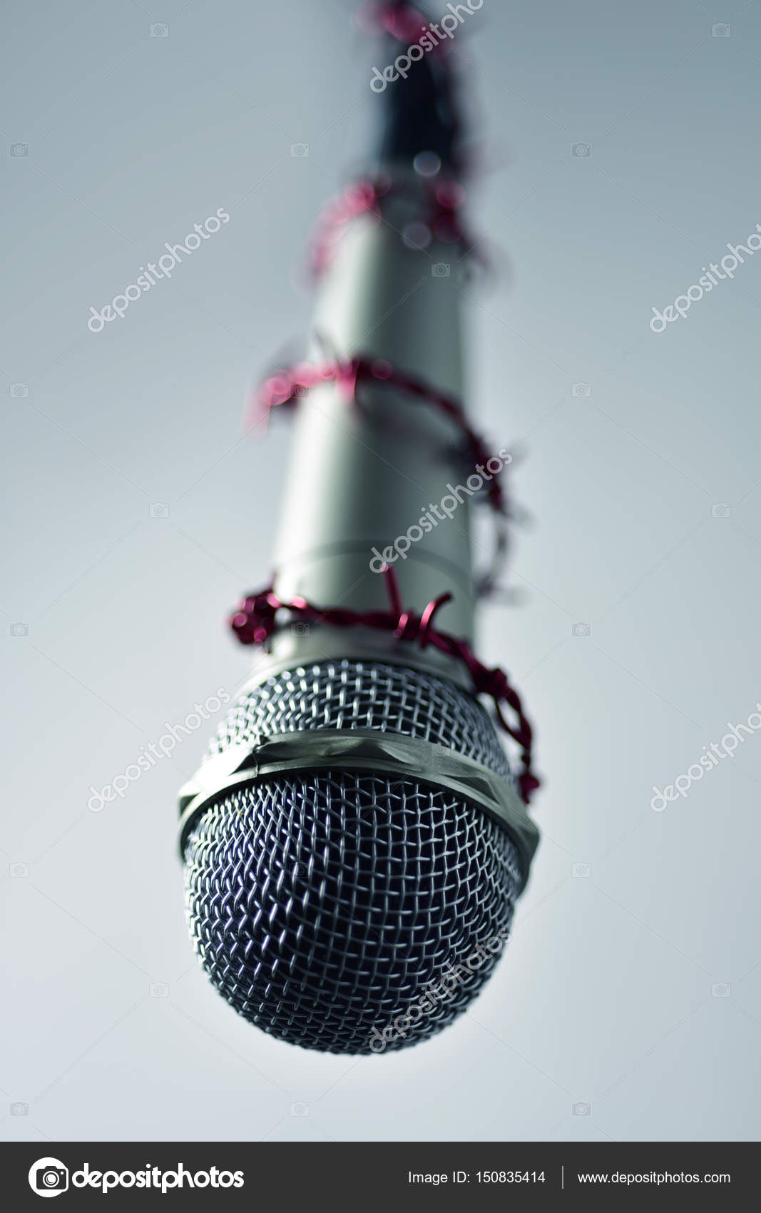 Barbed wire around a microphone — Stock Photo © nito103 #150835414