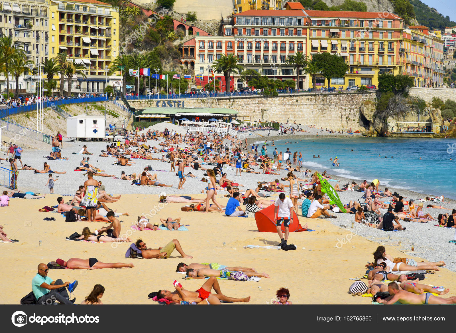 People sunbathing on the beach in Nice, France – Stock Editorial Photo ...