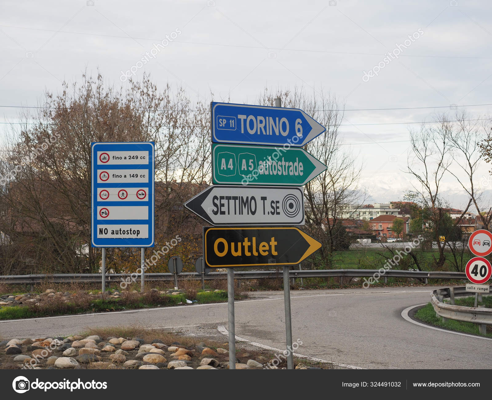 Many traffic signs – Stock Editorial Photo © claudiodivizia #324491032