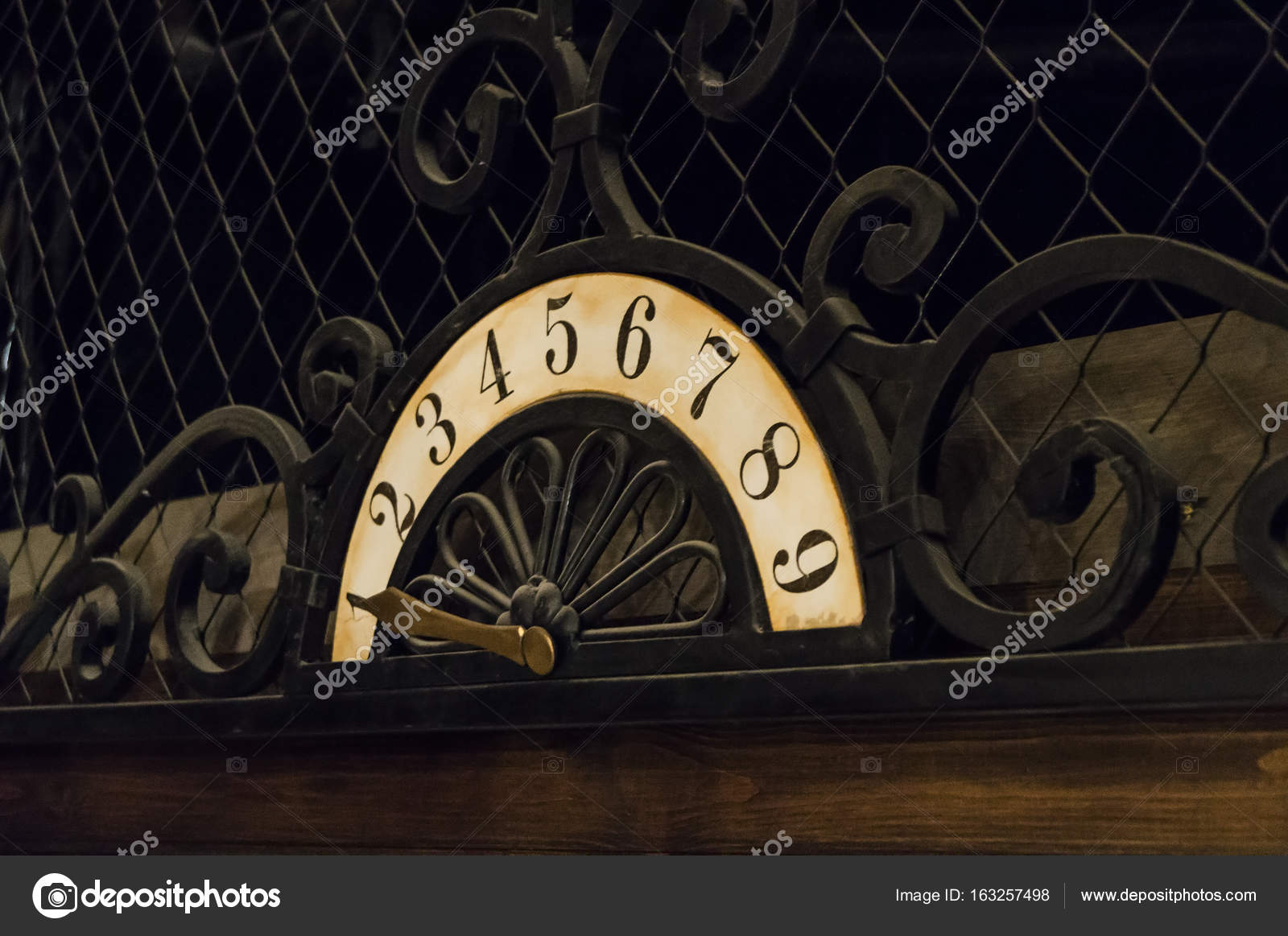 An ancient placard with figures and an iron pointer used in the ...