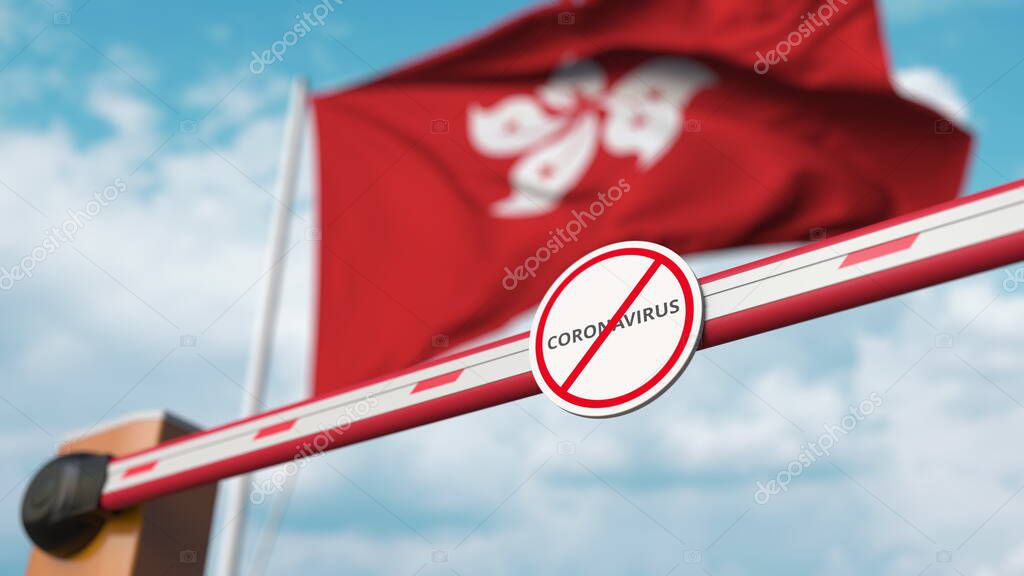 Puerta de pluma cerrada con señal de STOP CORONAVIRUS en el fondo de la ...