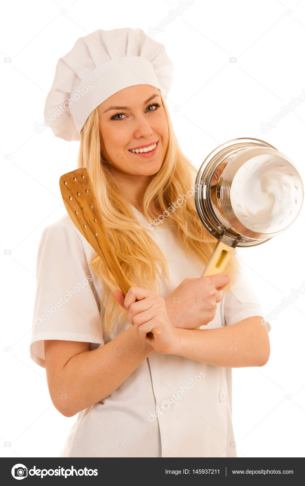 Young blonde chef woamn holds kitchenware as she prepares to coo ...