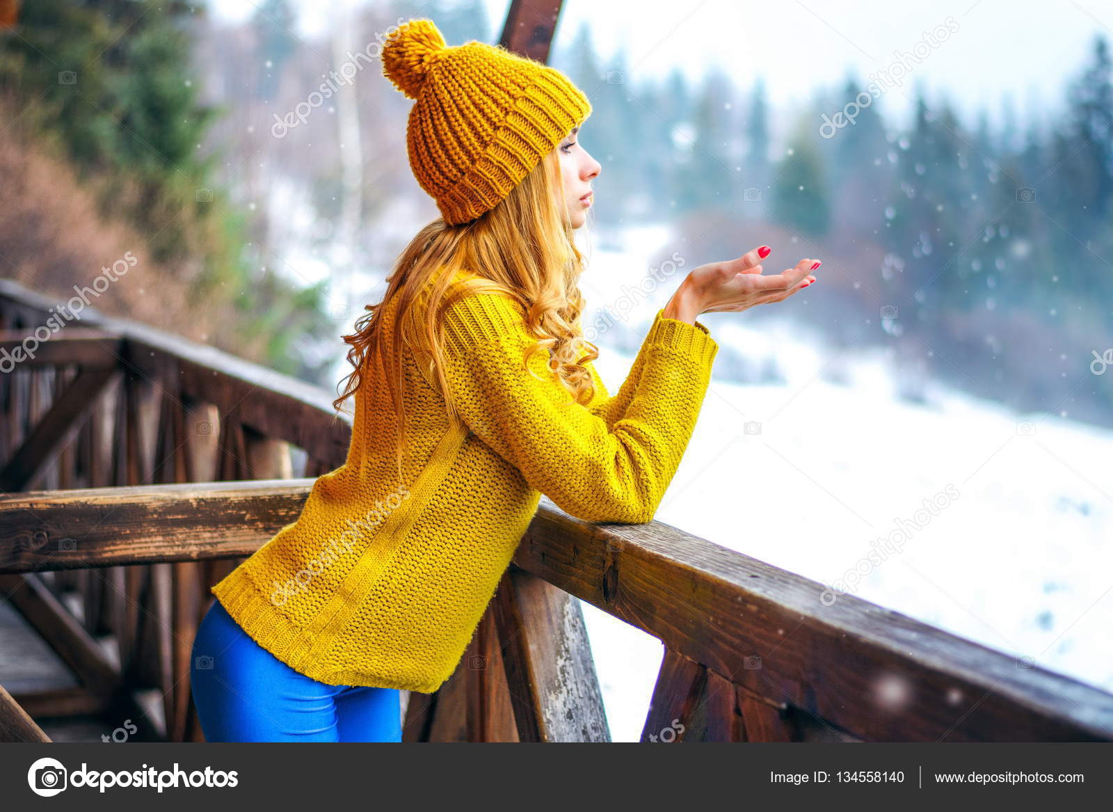 Girl in a sweater and hat catches the snow Stock Photo by ©shevdinov ...
