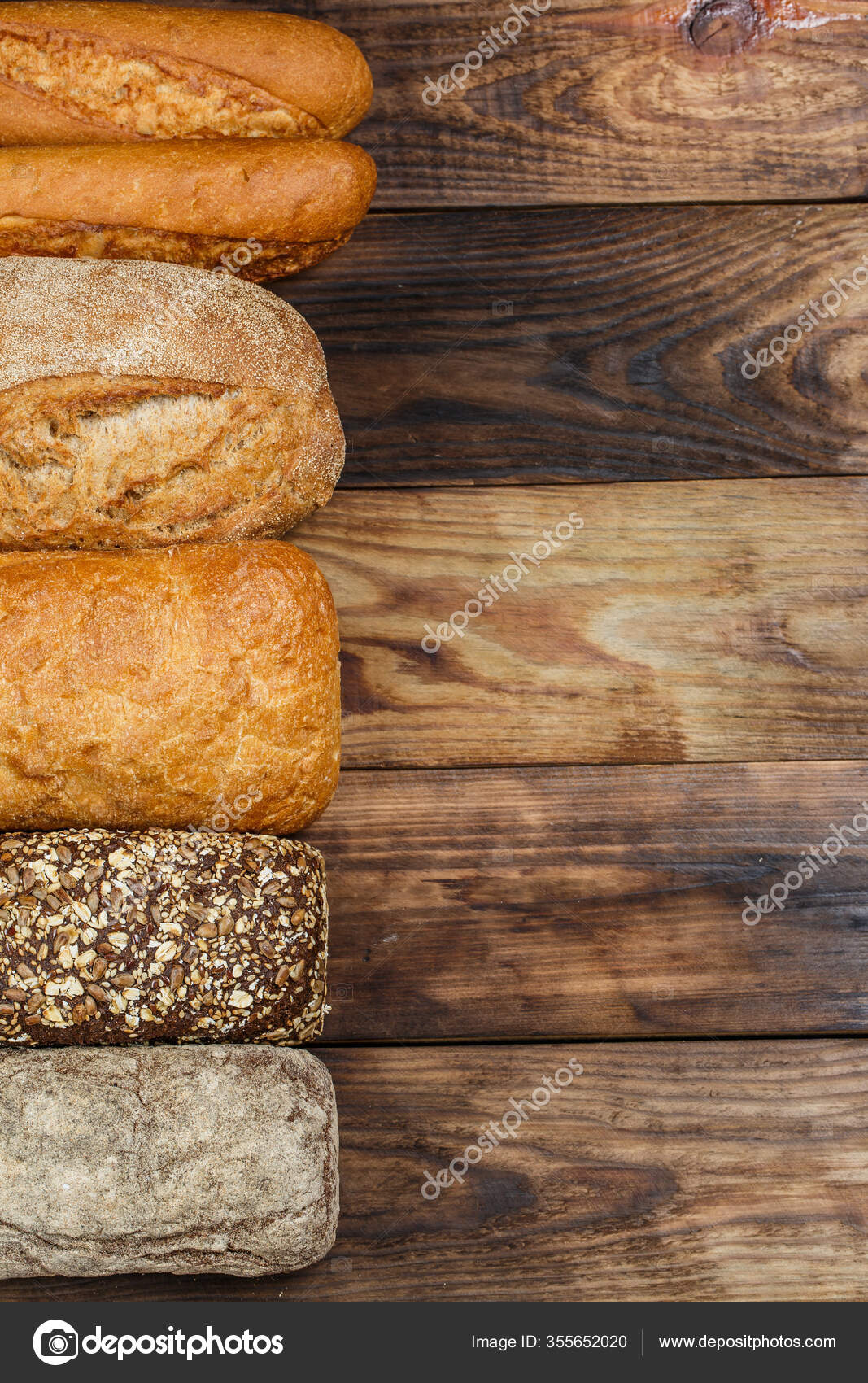 Different Loaves Bread Rolls Wheat Flour Wooden Table Stock Photo by ...