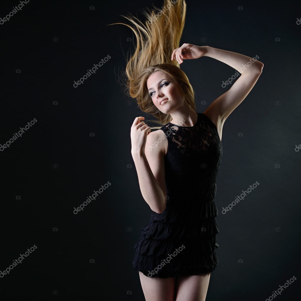 Attractive slim dancing girl Stock Photo by ©khorzhevska 128011612
