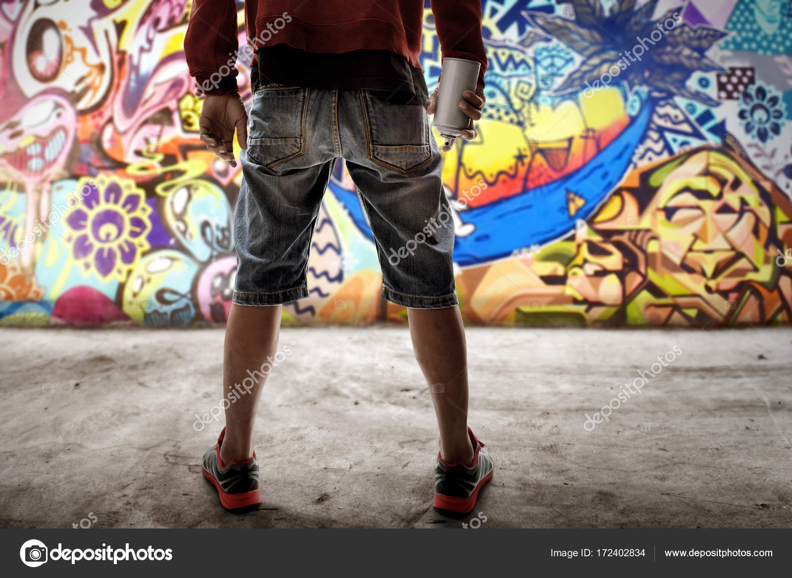 Graffiti artist stand holding spray paint — Stock Photo © fotokitas ...