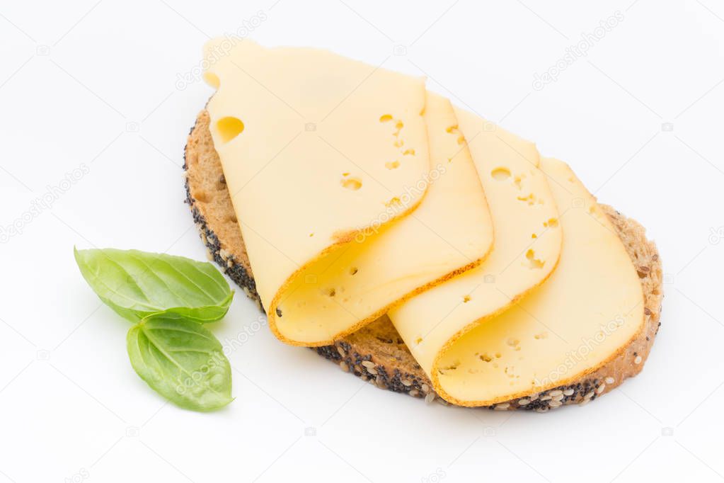 Cheese slices on bread. White background. Stock Photo by ©gitusik 129717564