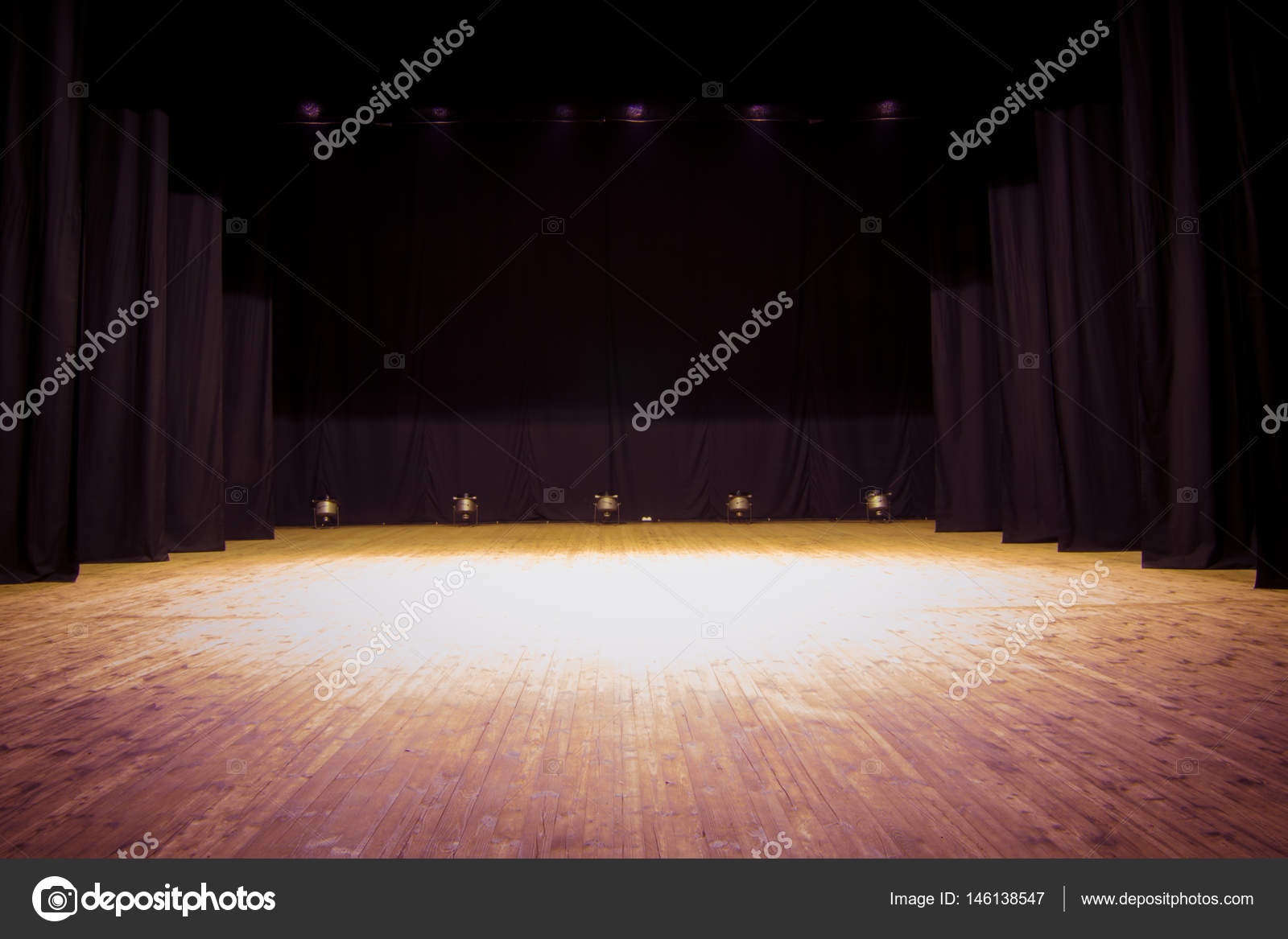 An empty stage of the theater, lit by spotlights before the performance ...