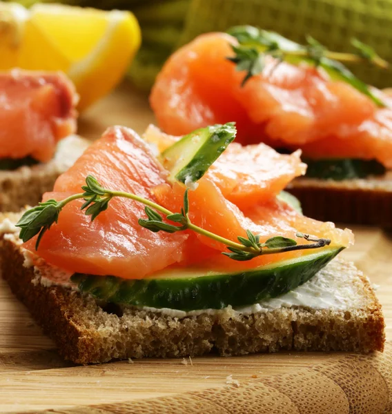 Canape sandwiches with red fish, cucumber and soft cheese Stock Photo ...