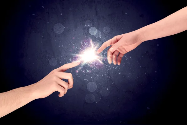 Hands reaching to light a spark — Stock Photo © ra2studio #152626704