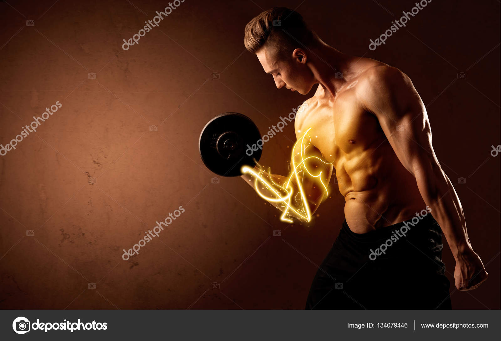 Muscular body builder lifting weight with energy lights on bicep ...