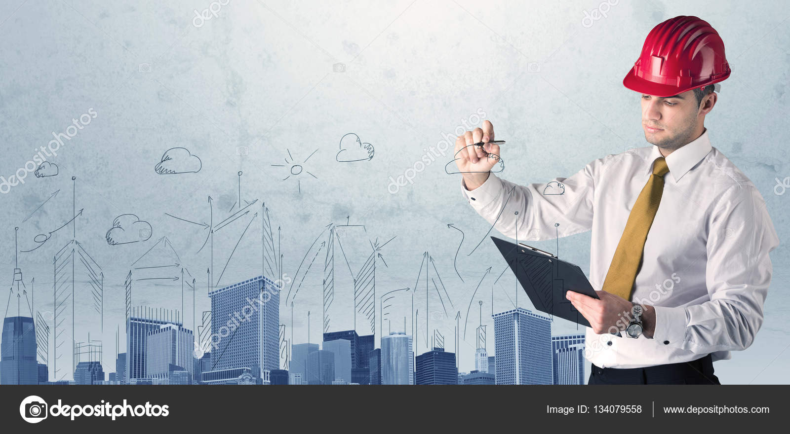 Young worker drawing a city sight Stock Photo by ©ra2studio 134079558