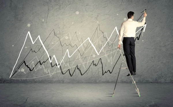 Man on ladder drawing lines Stock Photo by ©ra2studio 116273150