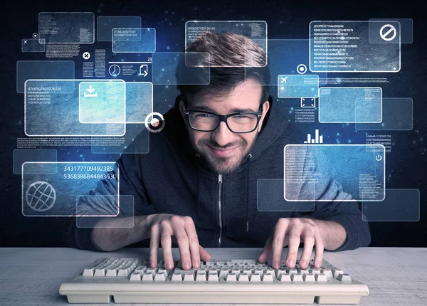 Nerd with glasses hacking websites Stock Photo by ©ra2studio 126696442