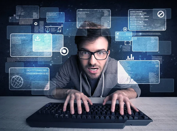 Nerd with glasses hacking websites Stock Photo by ©ra2studio 99714178