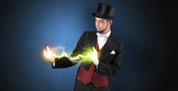 Magician energy between his hands Stock Photo by ©ra2studio 219851620