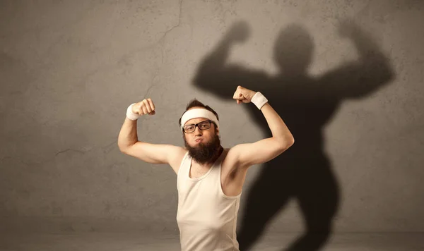 Skinny man with musculous shadow Stock Photo by ©ra2studio 184203166
