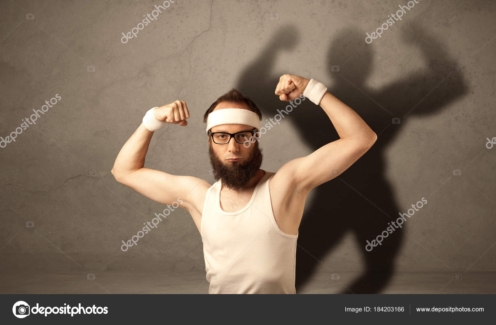Skinny man with musculous shadow Stock Photo by ©ra2studio 184203166