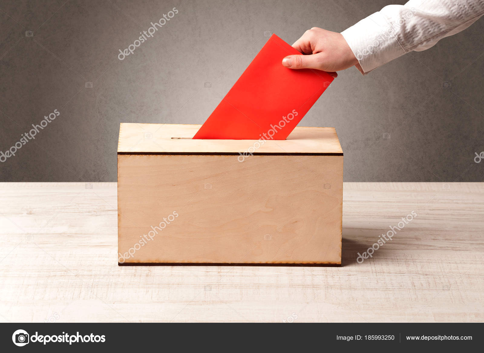 Ballot box with person casting vote Stock Photo by ©ra2studio 185993250
