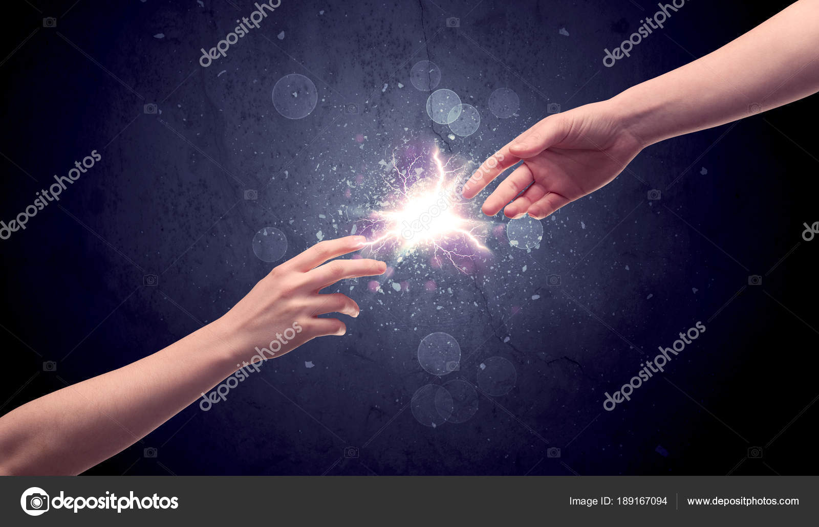 Hands reaching to light a spark Stock Photo by ©ra2studio 189167094