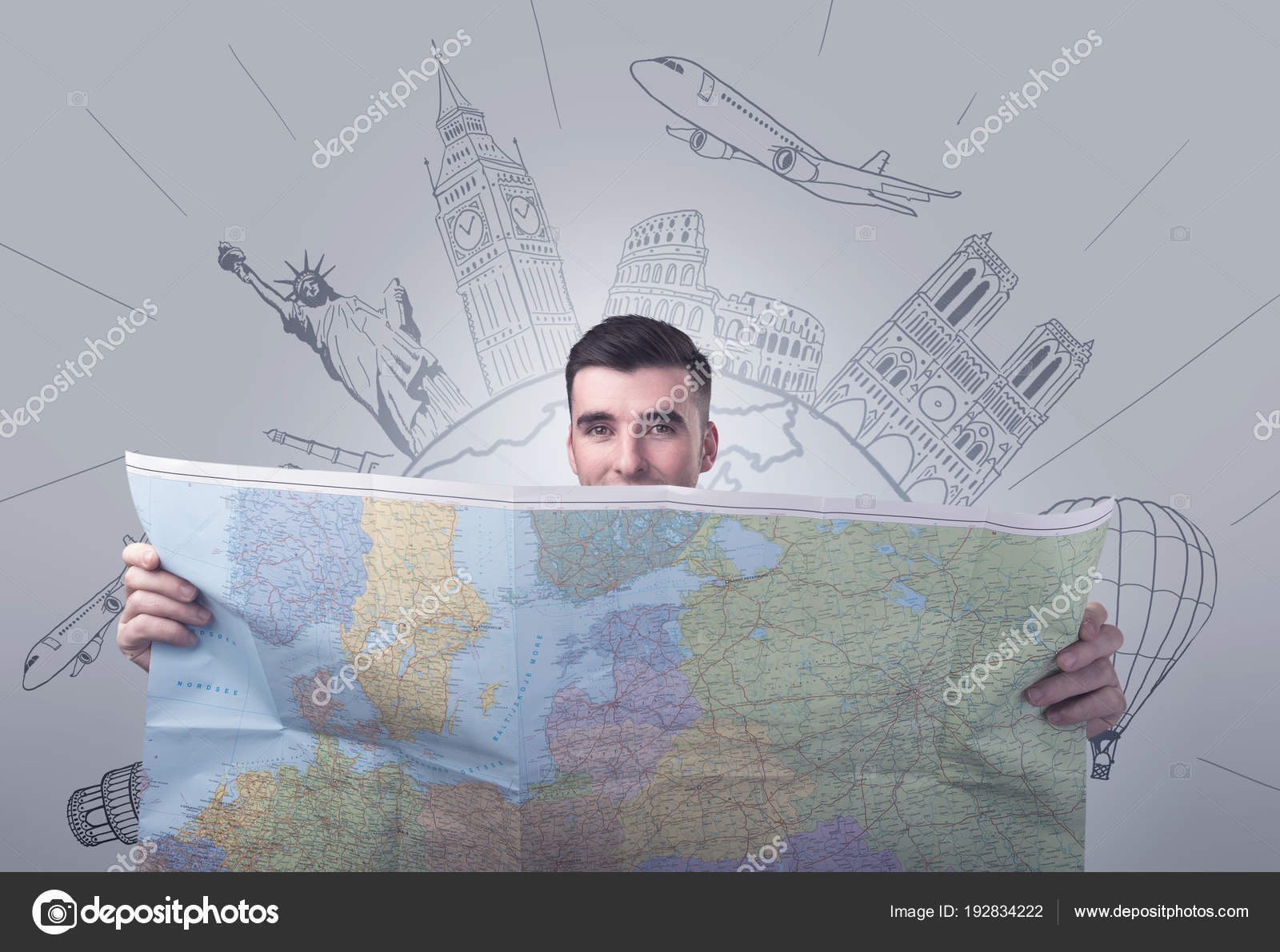 Young man holding map ⬇ Stock Photo, Image by © ra2studio #192834222