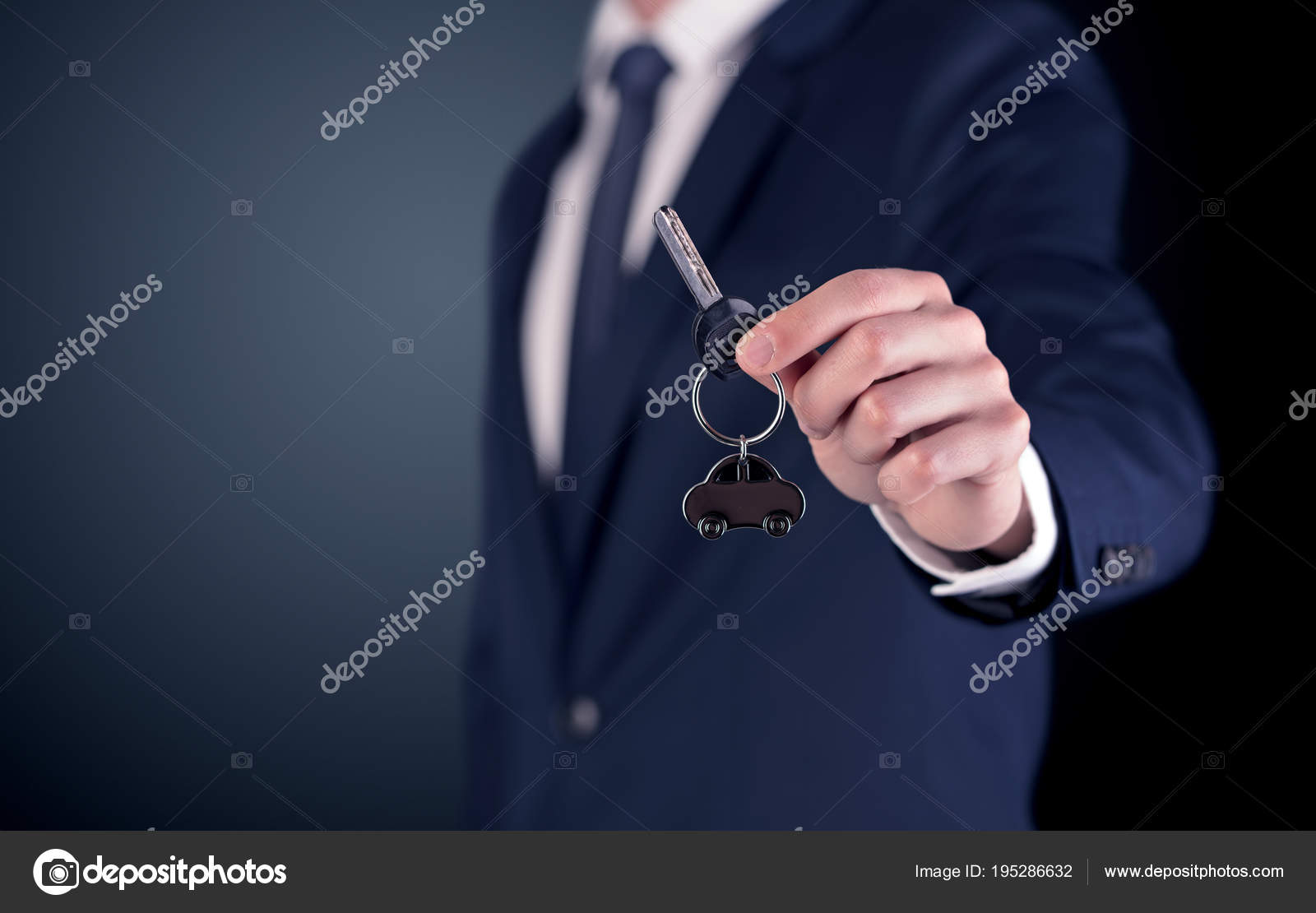 Young man hand over keys Stock Photo by ©ra2studio 195286632