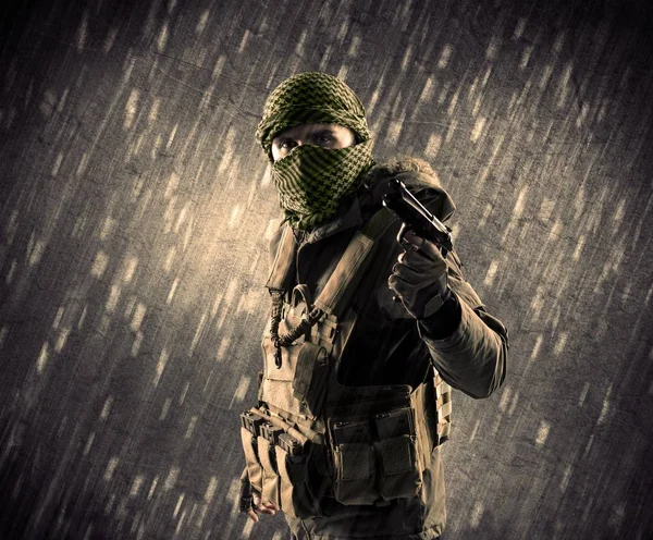 Armed terrorist man with mask on rainy background Stock Photo by ...