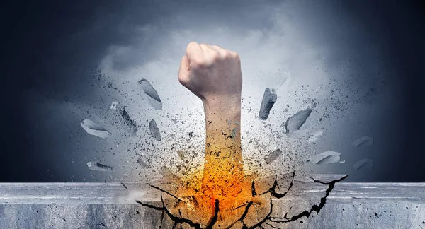 Hand hits intense and breaks stonewall — Stock Photo © ra2studio #224681322