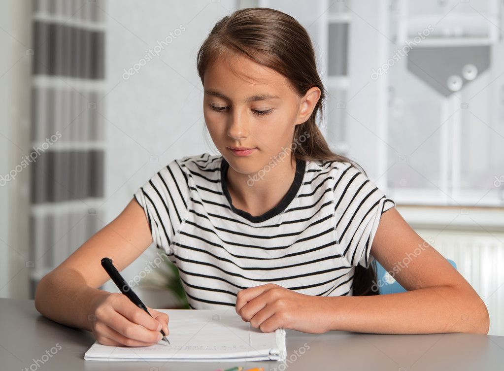 Beautiful girl working on her school project at home. — Stock Photo ...