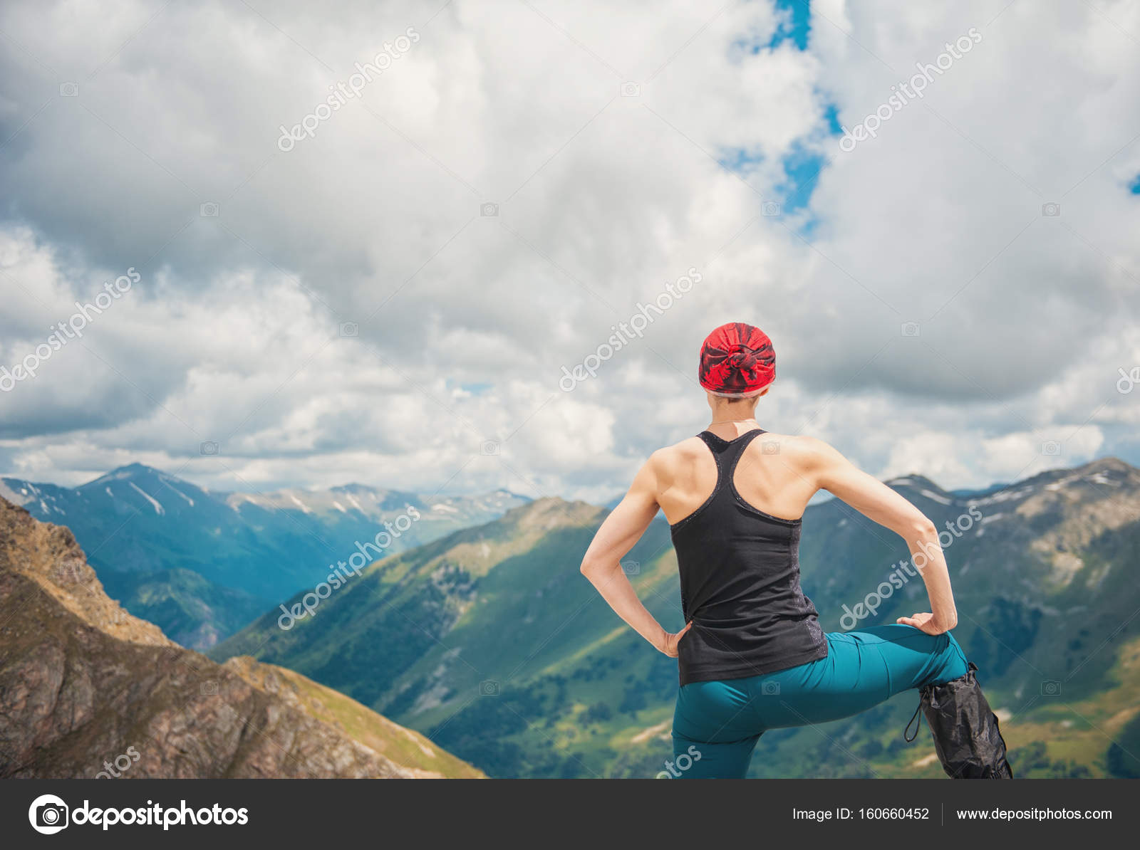 Woman hiker standing on the top of mountain. Back pose Stock Photo by ...