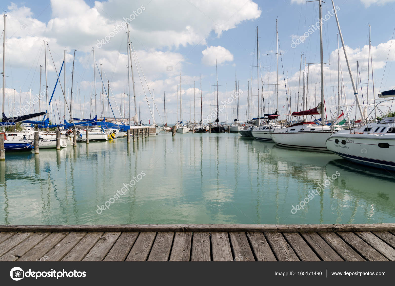 Harbor with modern sailing ships Stock Photo by ©klagyivik 165171490