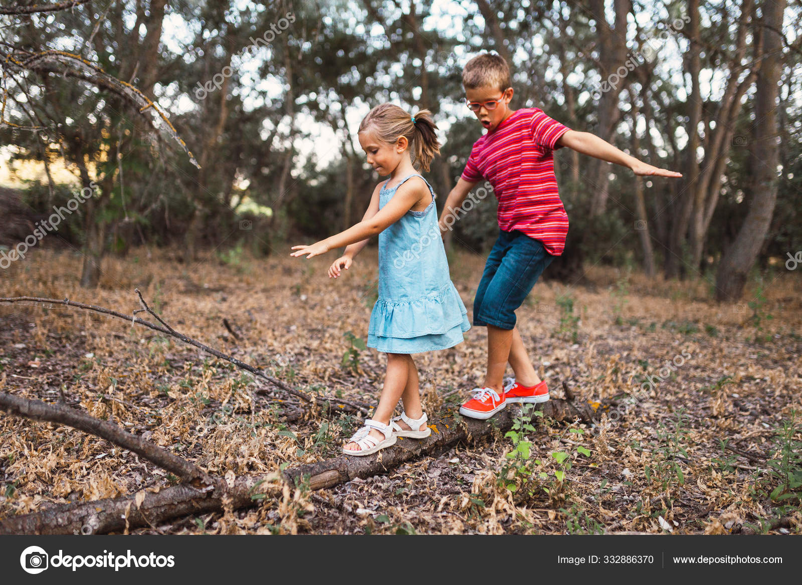 Two kids playing in the forest Stock Photo by ©vientocuatroestudio ...