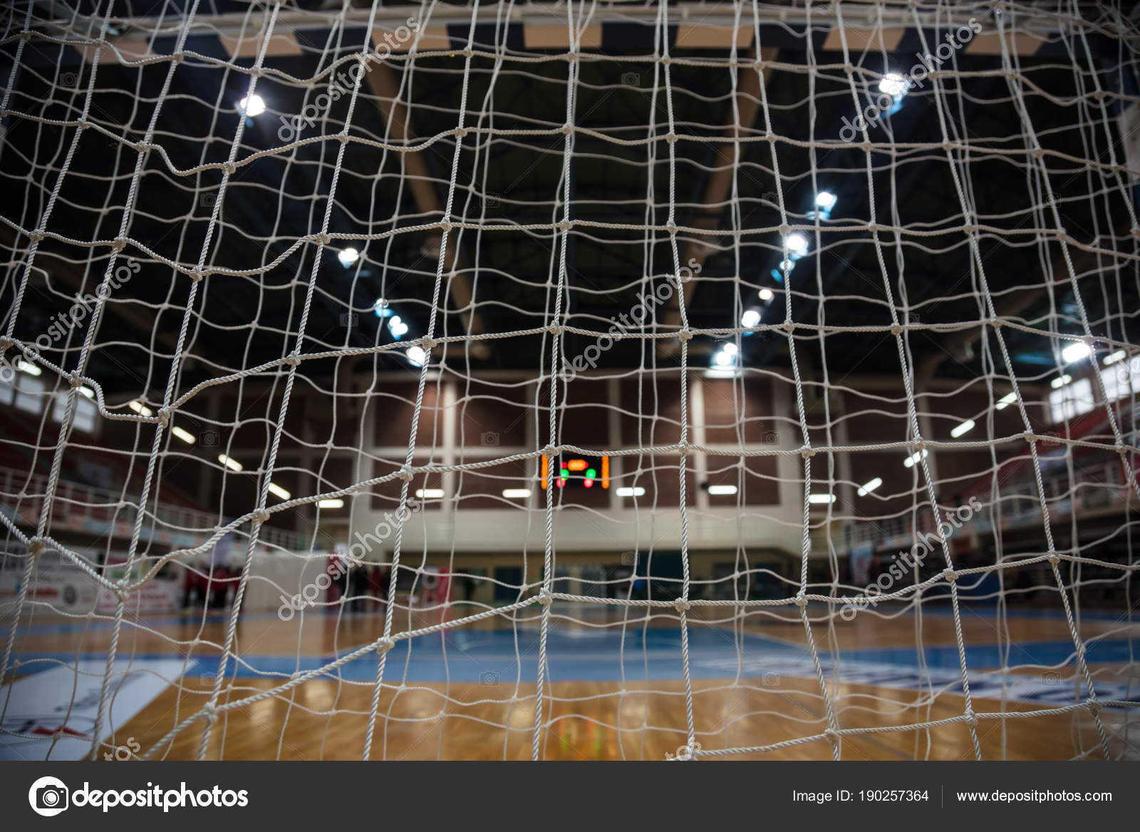 Handball concept. Goal post nets from behind view. Blurred court ...