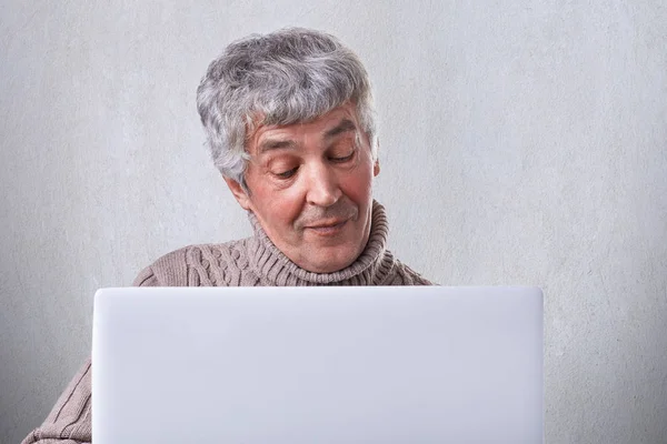 Confused grandfather using a pc Stock Photo by ©SIphotography 65198793