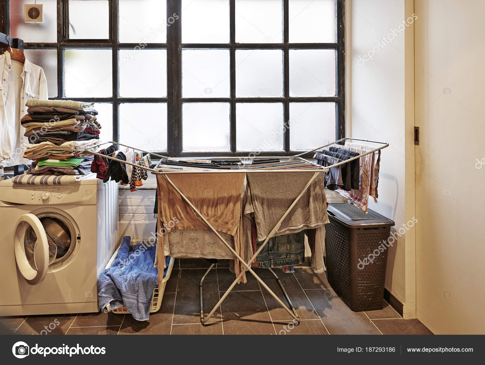 Untidy and messy male laundry room against windows — Stock Photo ...