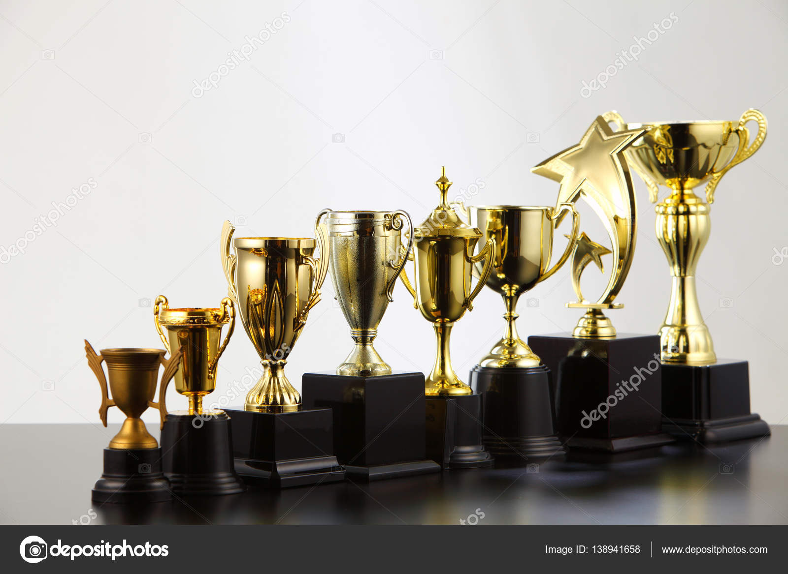 Different golden trophies — Stock Photo © eskaylim #138941658