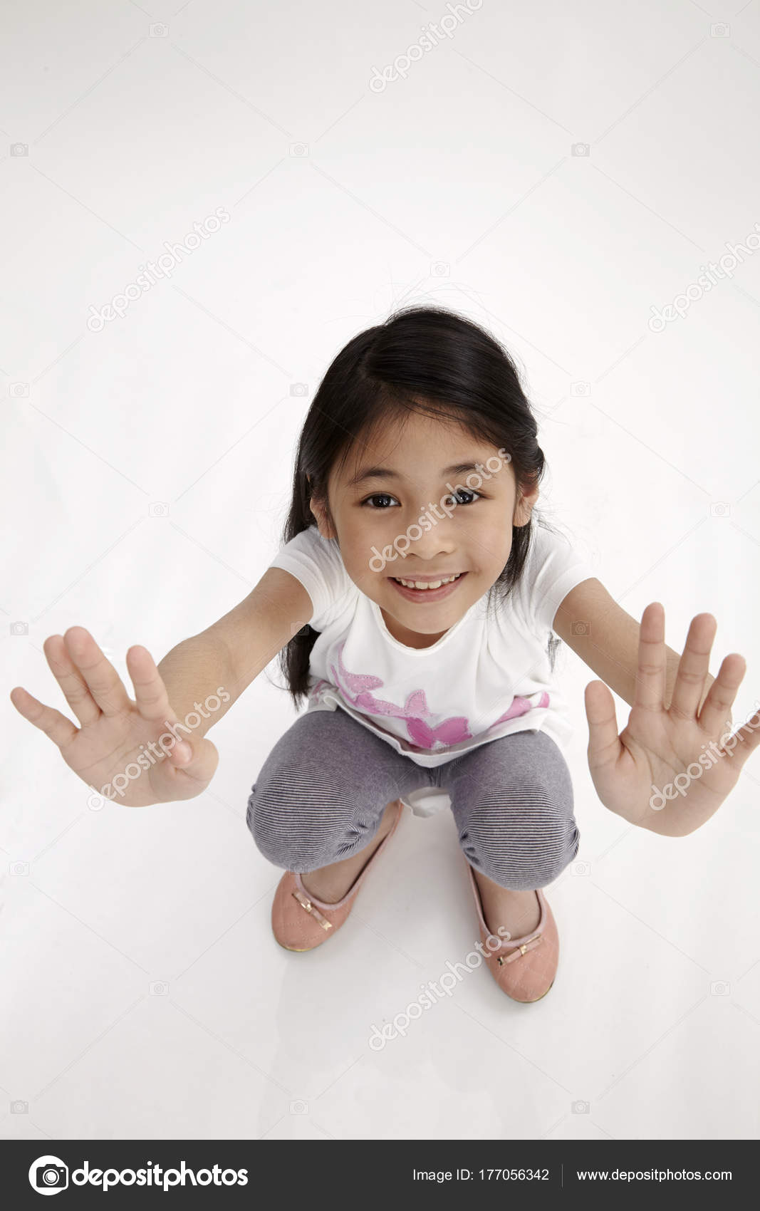 Kid Squatting Looking Upward Stock Photo by ©eskaylim 177056342