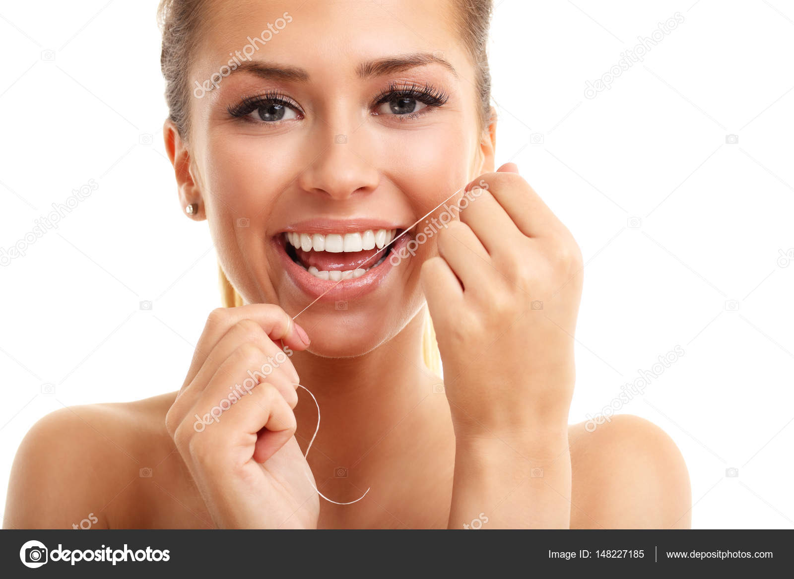 Woman flossing her teeth — Stock Photo © macniak #148227185