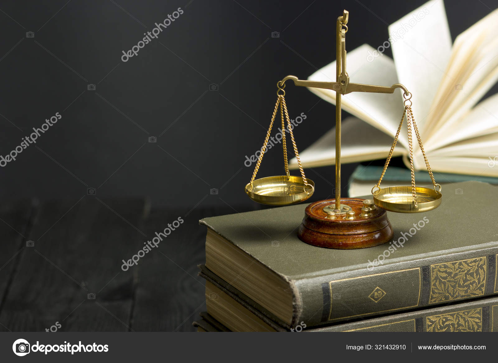 Law concept - Open law book with a wooden judges gavel on table in a ...