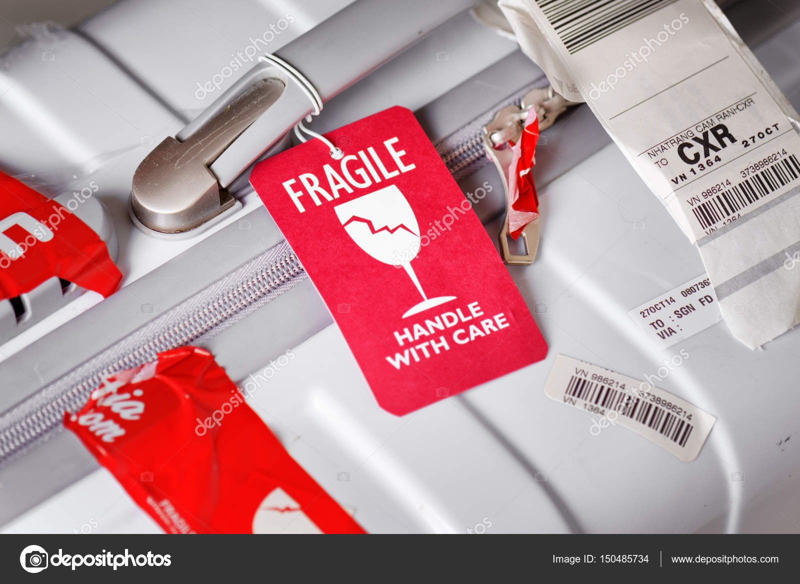 Red luggage tag (Fragile) attached to suitcase at airport – Stock ... Red luggage tag (Fragile) attached to suitcase at airport – Stock ...