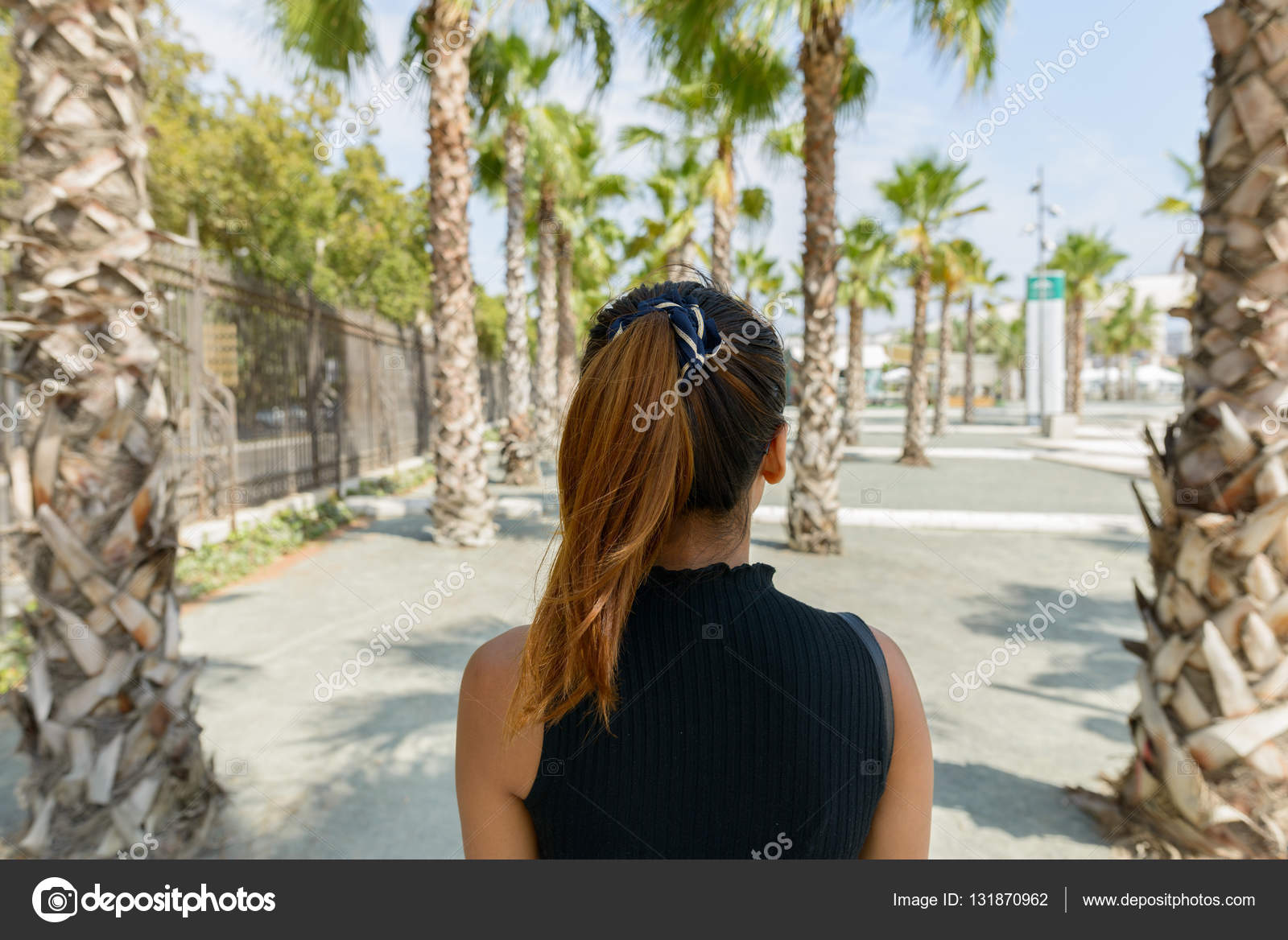 Back View Young Woman Outdoors Stock Photo by ©amazingmikael 131870962