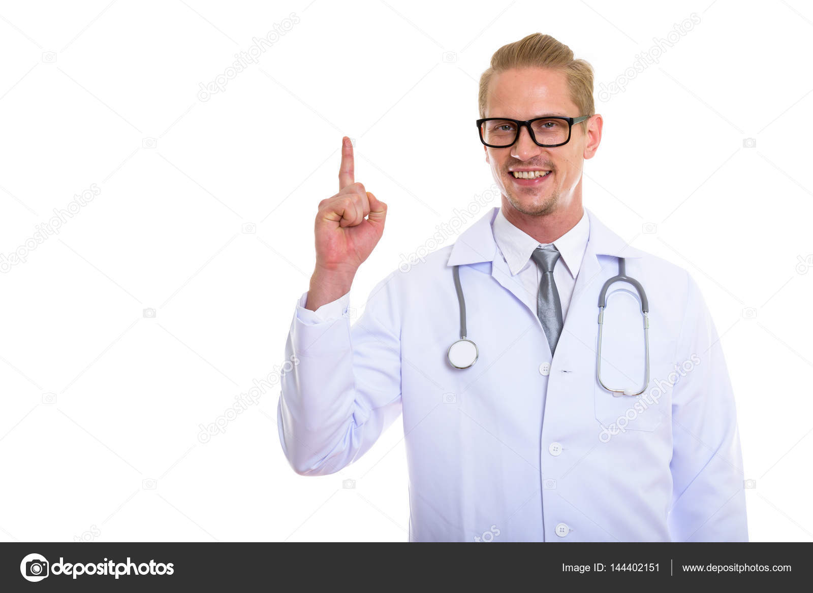 Studio Shot Young Happy Man Doctor Smiling While Pointing Finger ...