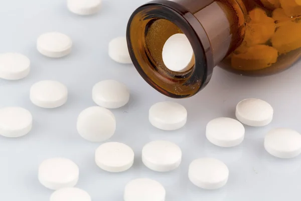 Many tablets with container Stock Photo by ©ginasanders 72815021