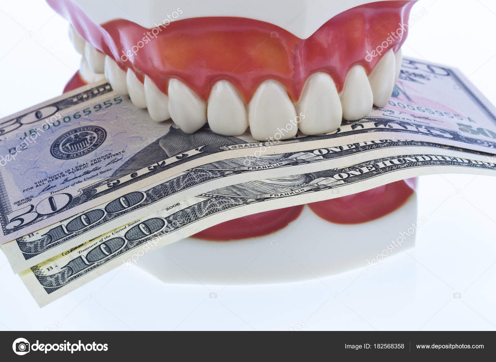 Teeth model with dollar bills Stock Photo by ©ginasanders 182568358