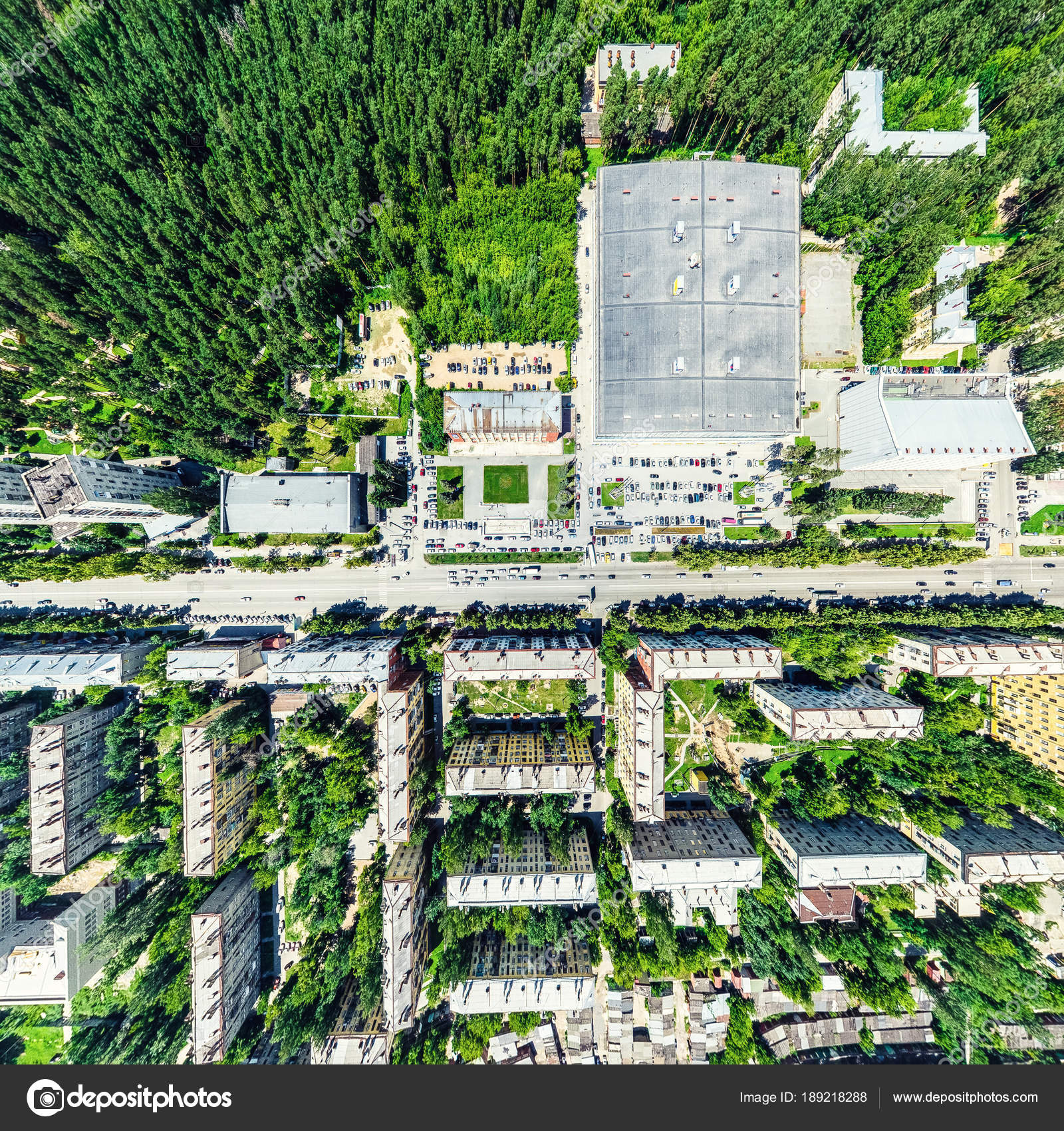 Aerial city view with crossroads and roads, houses, buildings, parks ...