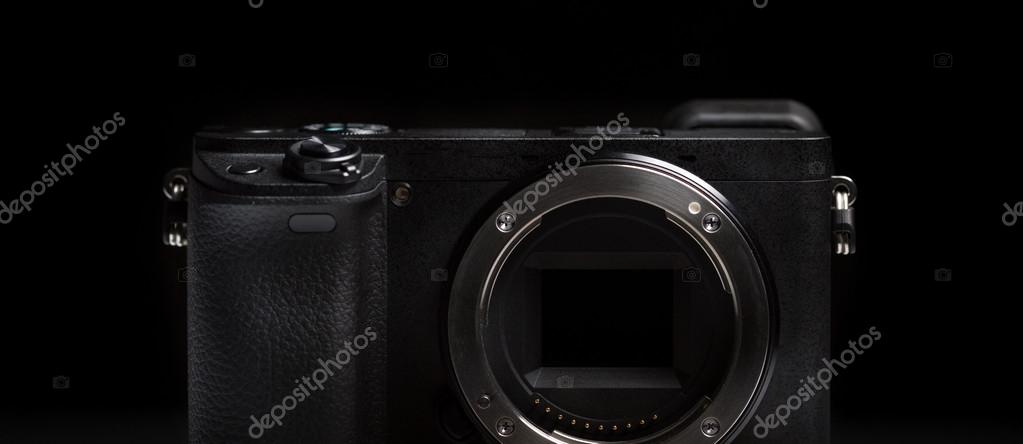 Mirrorless camera body on dark black background — Stock Photo © ronstik ...